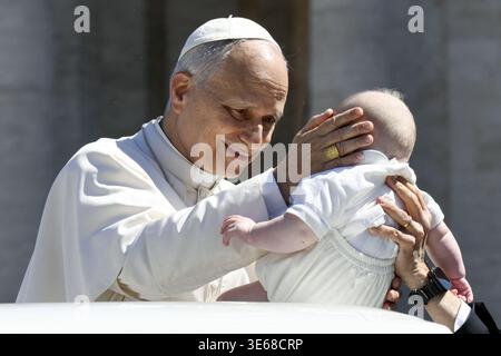 Pope Leo XIV waves to the faithful at the end of the Easter Sunday Mass ...