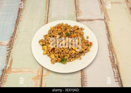 A generous portion of mixed meat chaufa rice (beef, chicken, and pork ...