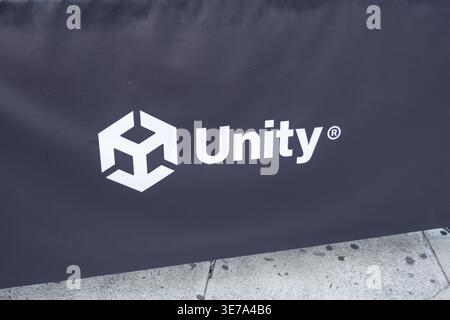 Unity logo and wordmark on black outdoor banner along sidewalk, San ...