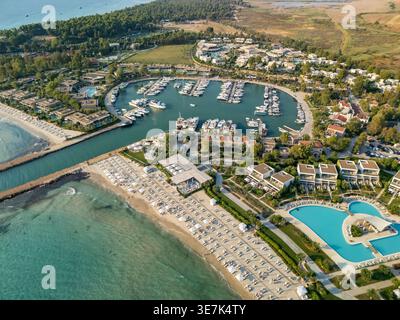 Aerial view of luxury boats and villas on Mediterranean Sea framed by ...