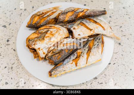 Crispy Skin Fish Served on a Bed of Vibrant Greens With a Side of ...