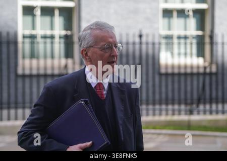 Northern Ireland Secretary Hilary Benn catches his footing on the cable ...