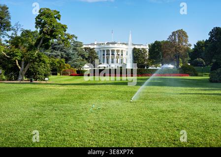 The sprinklers water the lawn of the White House, Sunday, May 31, 2026 ...