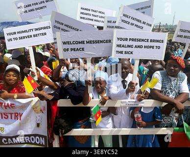 People wait for Pope Leo XIV in Luanda, Angola, Saturday, April 18 ...