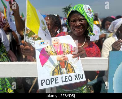 People wait for Pope Leo XIV in Luanda, Angola, Saturday, April 18 ...