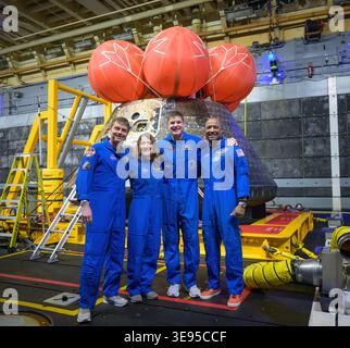 Astronauts Reid Wiseman and Victor Glover, right, wave to fans ahead ...