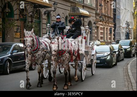 Krakow, Poland - April 10, 2026: Horses and carriages wait in Krakow ...