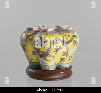 White gray and dark ceramic vases with striped and sunflower carved ...