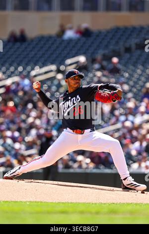 Minnesota Twins pitcher Taj Bradley, left, fist bumps a fan before a ...