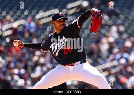 Minnesota Twins pitcher Taj Bradley, left, fist bumps a fan before a ...