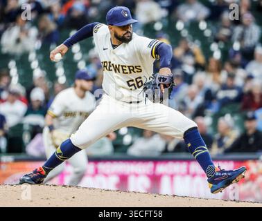 Milwaukee Brewers pitcher Grant Anderson attempts to pick off a base ...
