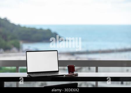 Sea office shows remote working. Man working remotely near water ...
