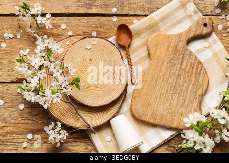 Different wooden cutting boards with beautiful blooming tree branches ...