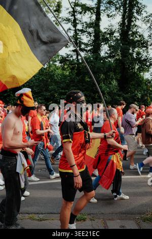 A World Cup soccer fan carries an American flag around the Lincoln ...