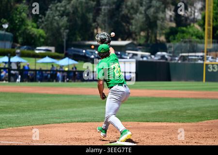 Gabe Miranda (26) of the Oregon Ducks follows through on a swing during ...