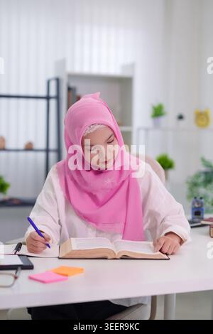women seated at home office writing notes journal planning tasks with ...