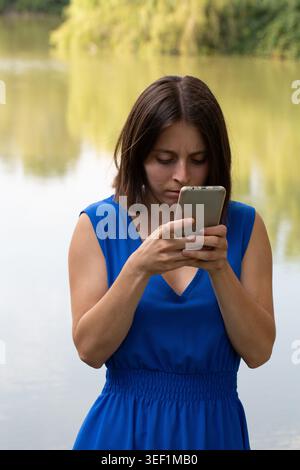 Young adult woman checking content of package received while relaxing ...