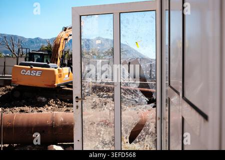 Heavy machinery removes soil debris at construction site preparing area ...