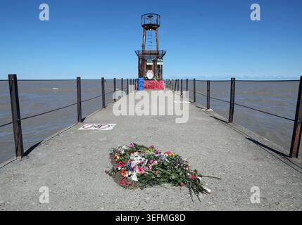 Flowers lie on the pier at Tobey Prinz Beach in Chicago on March 23 ...