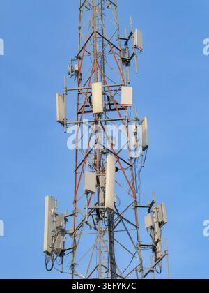 A tall radio transmission mast rises above the barren volcanic ...