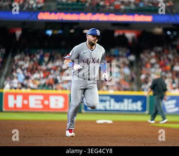 Texas Rangers first baseman Jake Burger tosses the ball during a ...