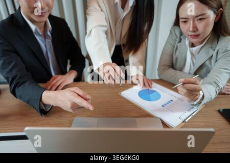 Asian business team collaborating on UI UX design creative process in ...
