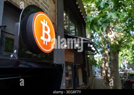 A Bitcoin cryptocurrency logo is displayed on an ATM machine in Tbilisi ...