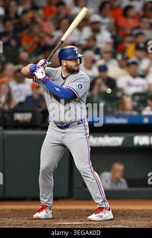 Texas Rangers first baseman Jake Burger tosses the ball during a ...