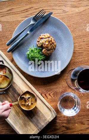 Savoring a Delicious Seafood Dish at a Cozy Restaurant With Natural ...