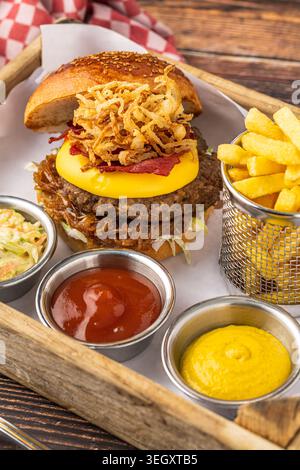 Beef burger with cheddar cheese bacon and crispy onions Stock Photo - Alamy