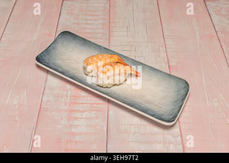photography captures the reflection of the assorted nigiri on the red ...