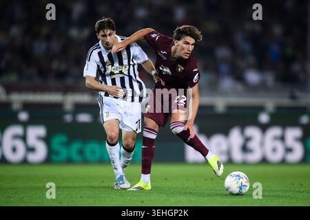 Cesare Casadei of Torino FC competes for the ball with Fabio Miretti of ...