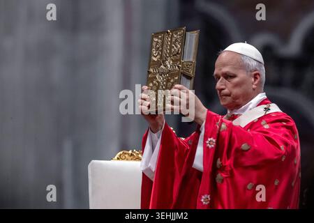 Pope Leo XIV holds the gospel during a Mass for the Solemnity of ...