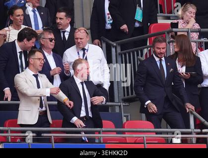 Salford City co-owners Sir David Beckham (front left) and Gary Neville ...