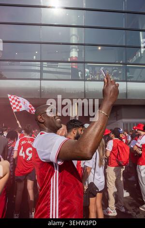 A man takes a selfie as soccer fans celebrate while Canada plays Qatar ...