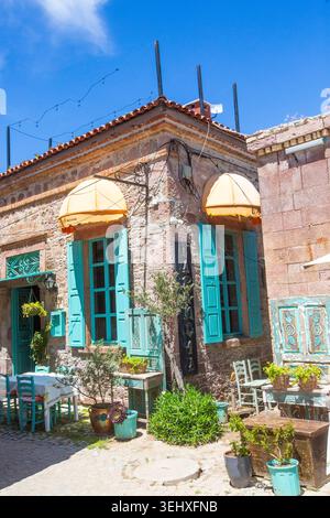 Ayvalik - Turkey, May 17, 2026, Stone houses and taverns in the back ...