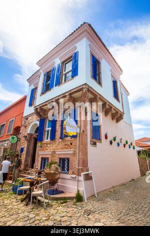 Ayvalik - Turkey, May 17, 2026, Stone houses and taverns in the back ...