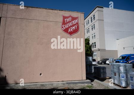 Side view of The Salvation Army building with red shield logo and ...