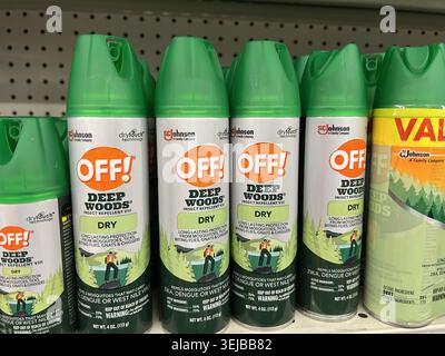 Containers of OFF pest spray or insect repellent on a store shelf in ...