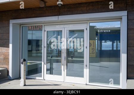 Entrance doors with Above The Rim and Chase Center signage on a modern ...