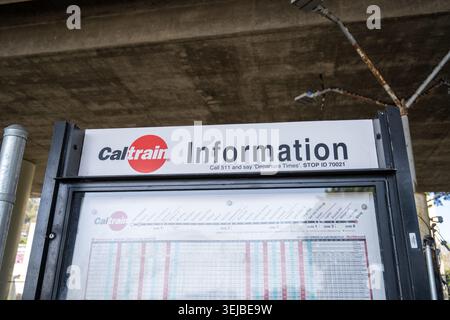 Caltrain information sign and timetable display at commuter rail ...
