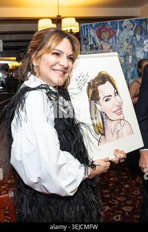 Shoshana Bean (R) poses as she is honored with a portrait at Sardi's in ...
