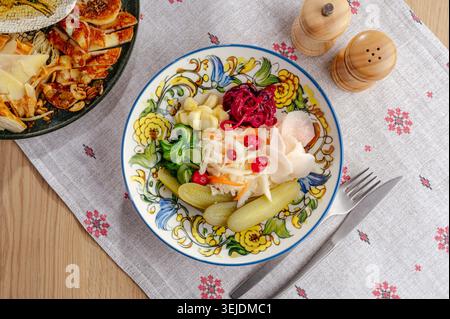 Colorful plate of assorted pickled vegetables arranged with a flower ...
