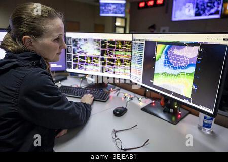 Senior Service Hydrologist Amanda Schroeder points to a reflectivity ...