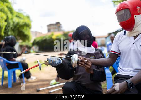 Head coach, Martin Musili seen taking a member of Kenya’s para fencing ...