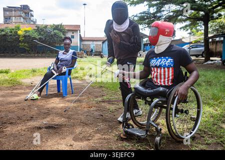 Head coach, Martin Musili seen taking a member of Kenya’s para fencing ...