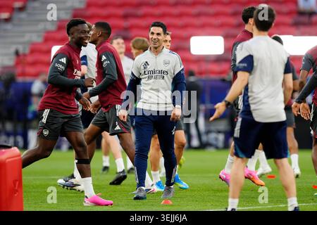 Arsenal manager Mikel Arteta (centre right) and Bukayo Saka during a ...
