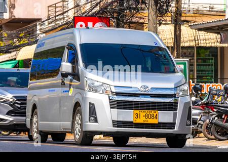 Transport van moving through lively tourist destination streets with ...