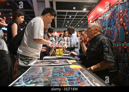 Bob Layton, an American comic book artist, posing photo with a lady at ...