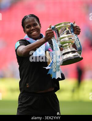 Khadija Shaw of Manchester City lifts the trophy after winning the ...